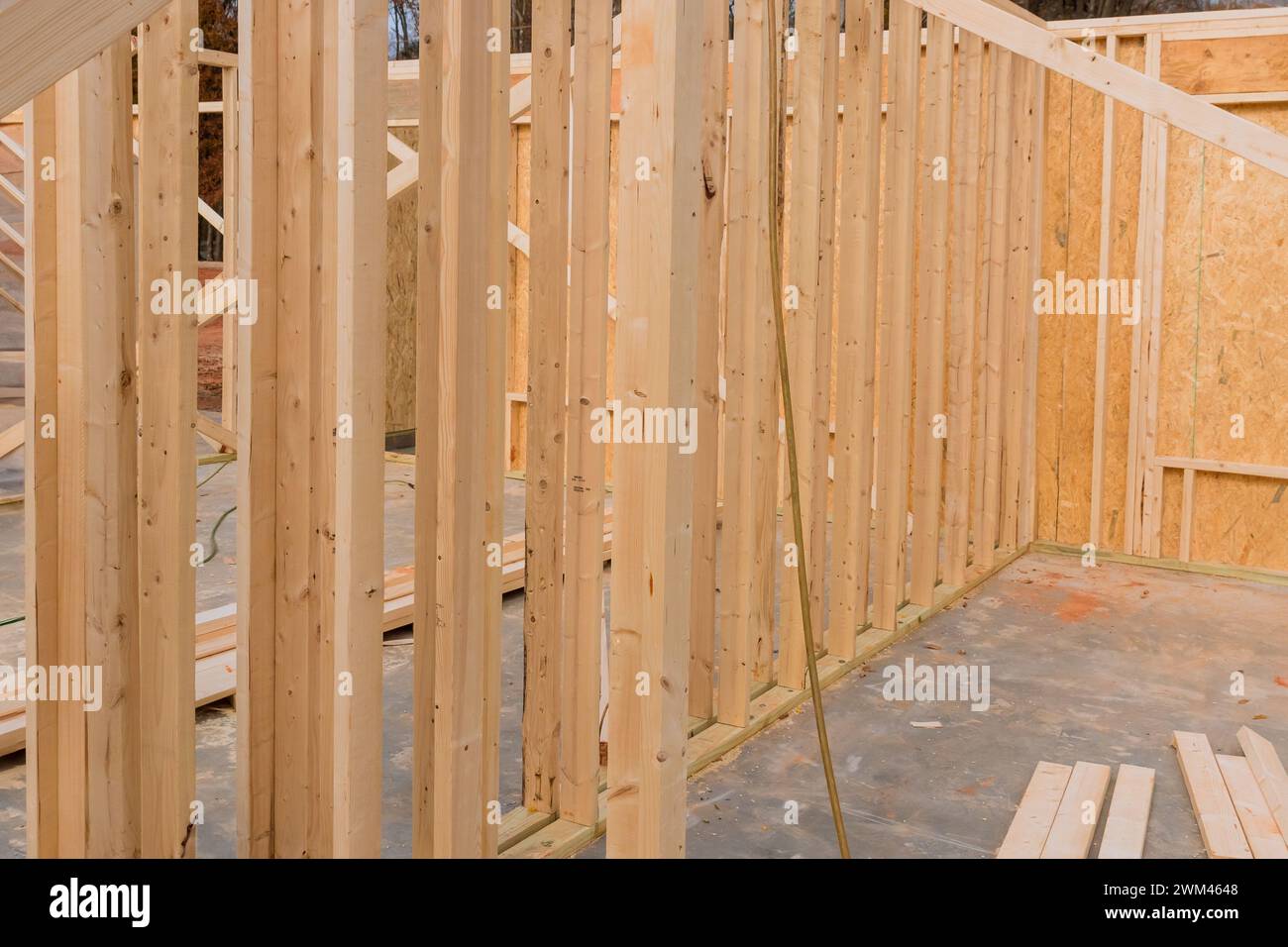 Construction of new home involves use of stick beams, wood, framing ...