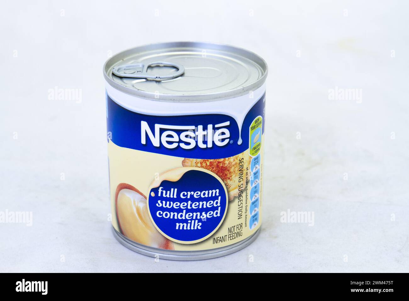 Johannesburg, South Africa - a tin of Nestle condensed milk isolated on ...