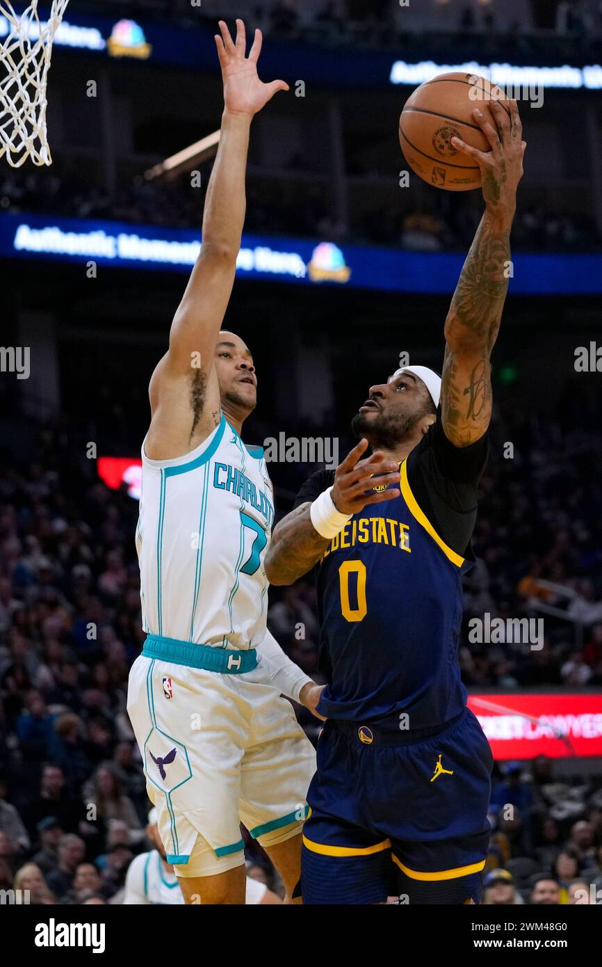 Golden State Warriors guard Gary Payton II, right, shoots while ...