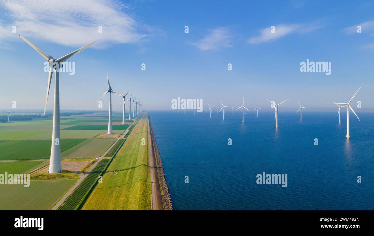An aerial view of a wind farm on a plain in the middle of the ocean ...