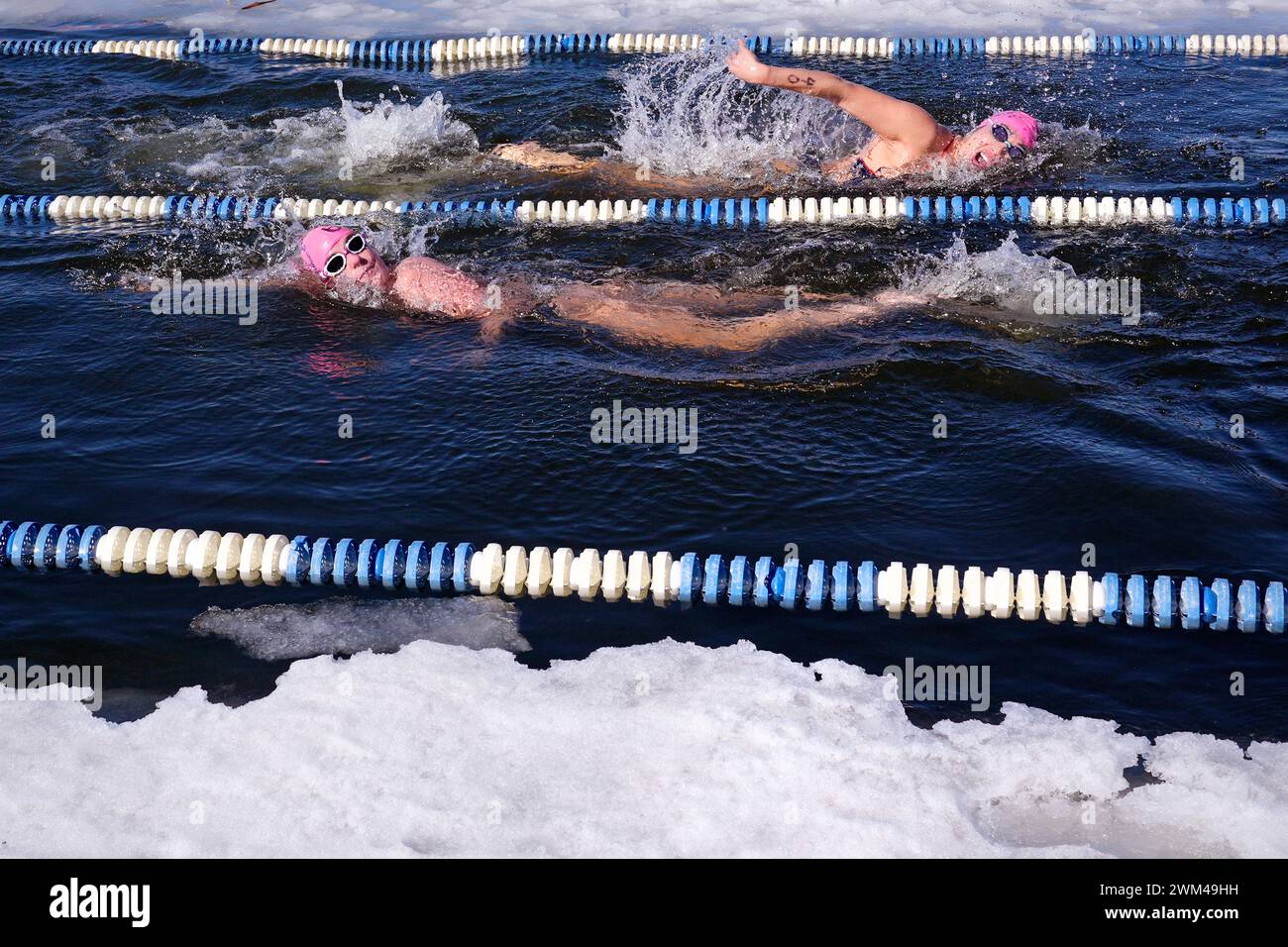 Athletes race during the 200 meter freestyle competition in the winter ...