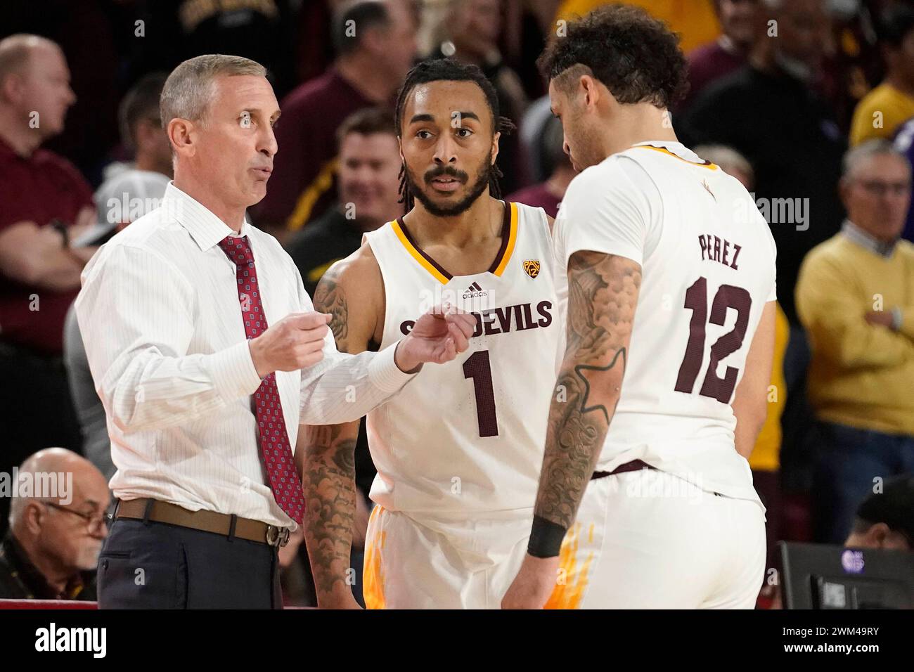 Arizona State head coach Bobby Hurley, left talks with his guard ...