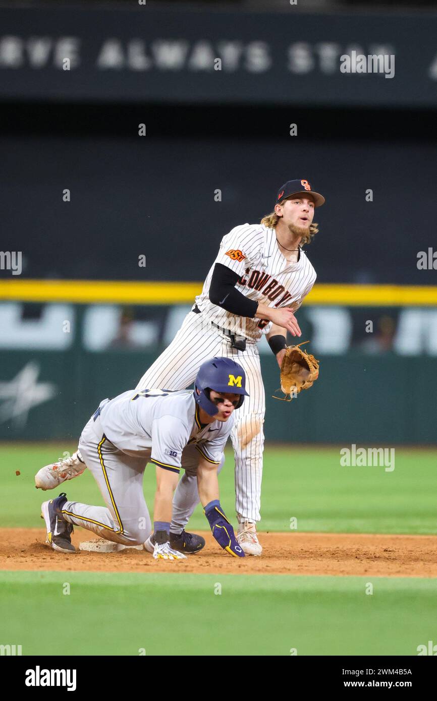 February 23, 2024: Michigan base runner Jonathan Kim #21 glances over ...