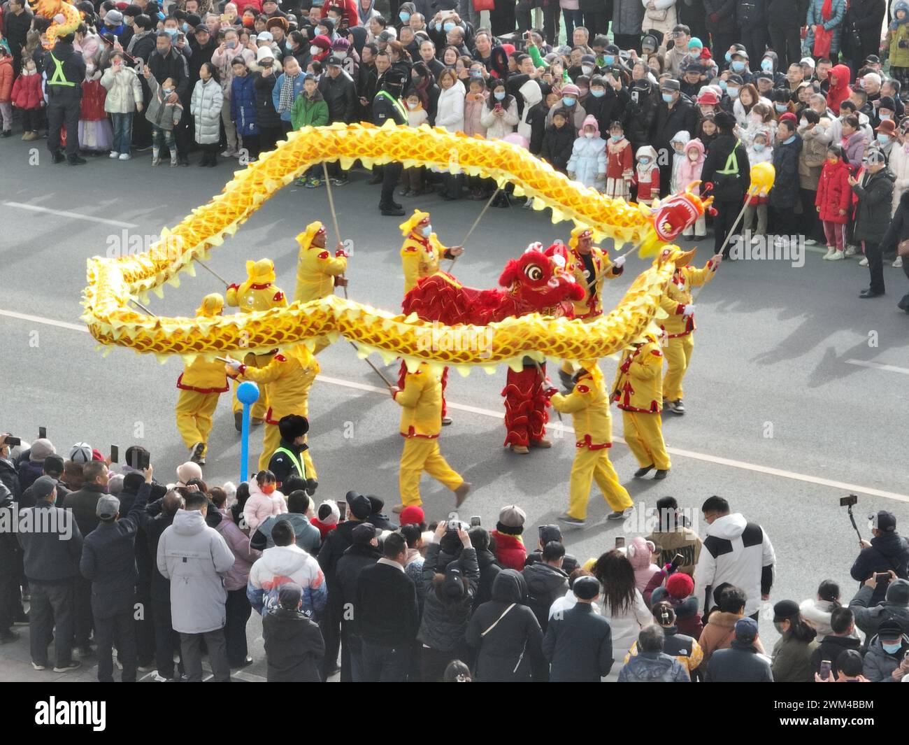 KORLA, CHINA - FEBRUARY 24, 2024 - Folk artists perform a dragon dance ...