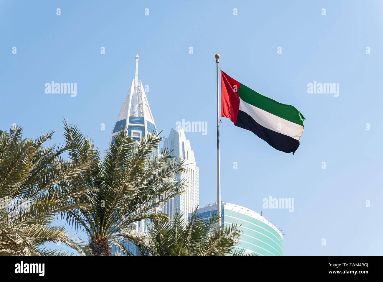 Flag waving at the top of the modern building, national symbol of ...