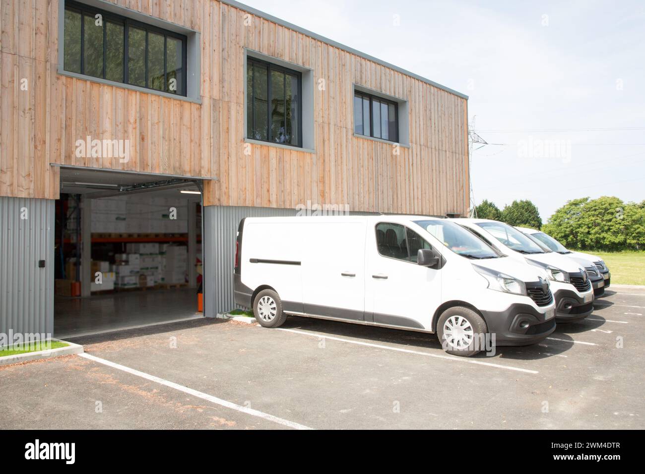 commercial delivery vans in parking place of transporting carrier ...