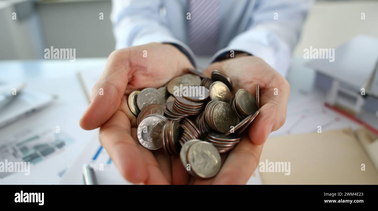 Hand businessman putting pin money Stock Photo - Alamy