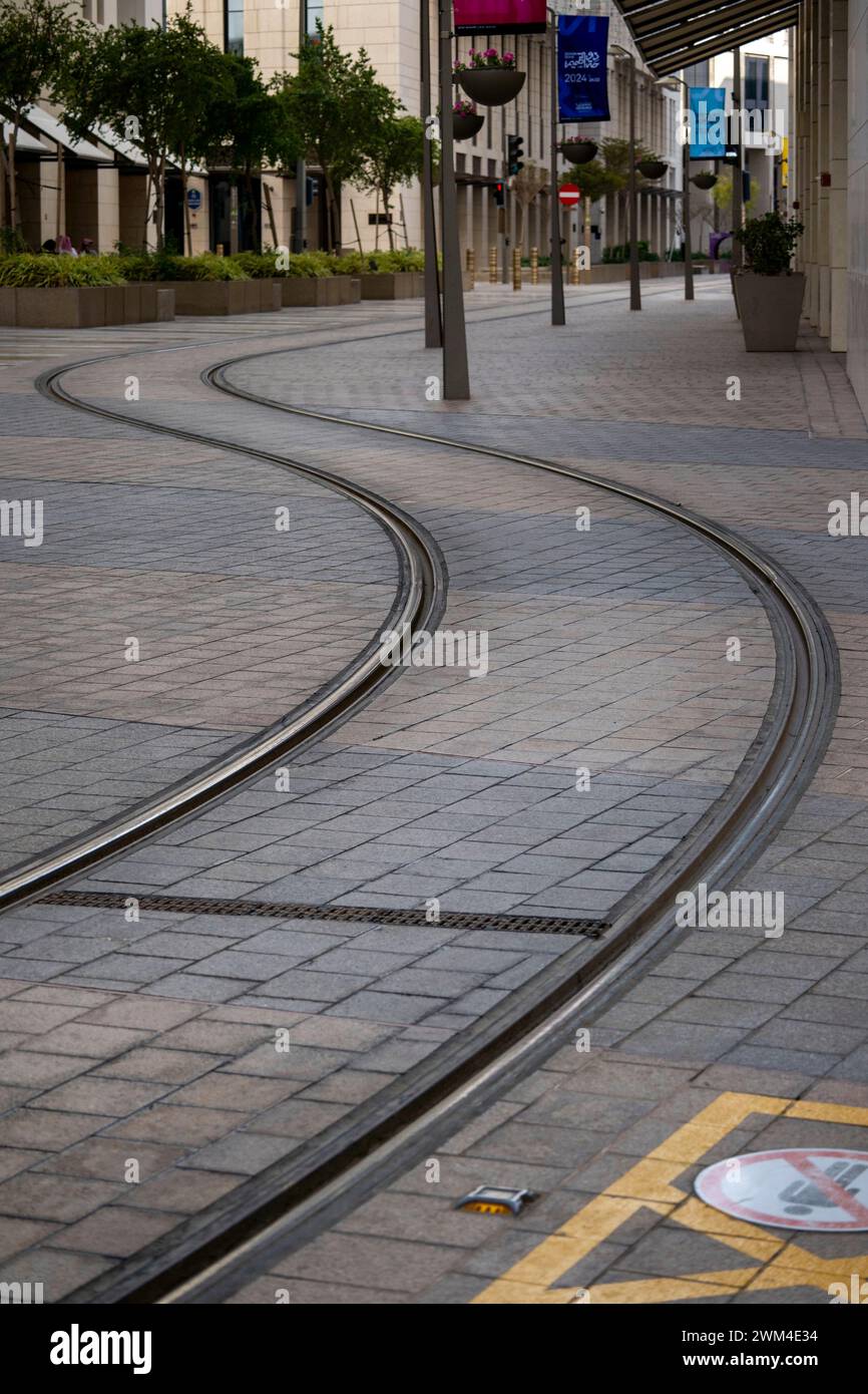 Doha, Qatar - February 23, 2024: Crossroad of tram rail lines Msheireb ...