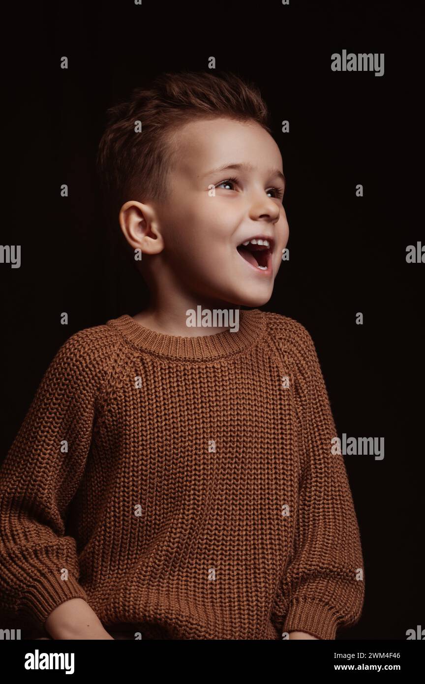 portrait of a happy screaming stylish white Caucasian child preschooler ...