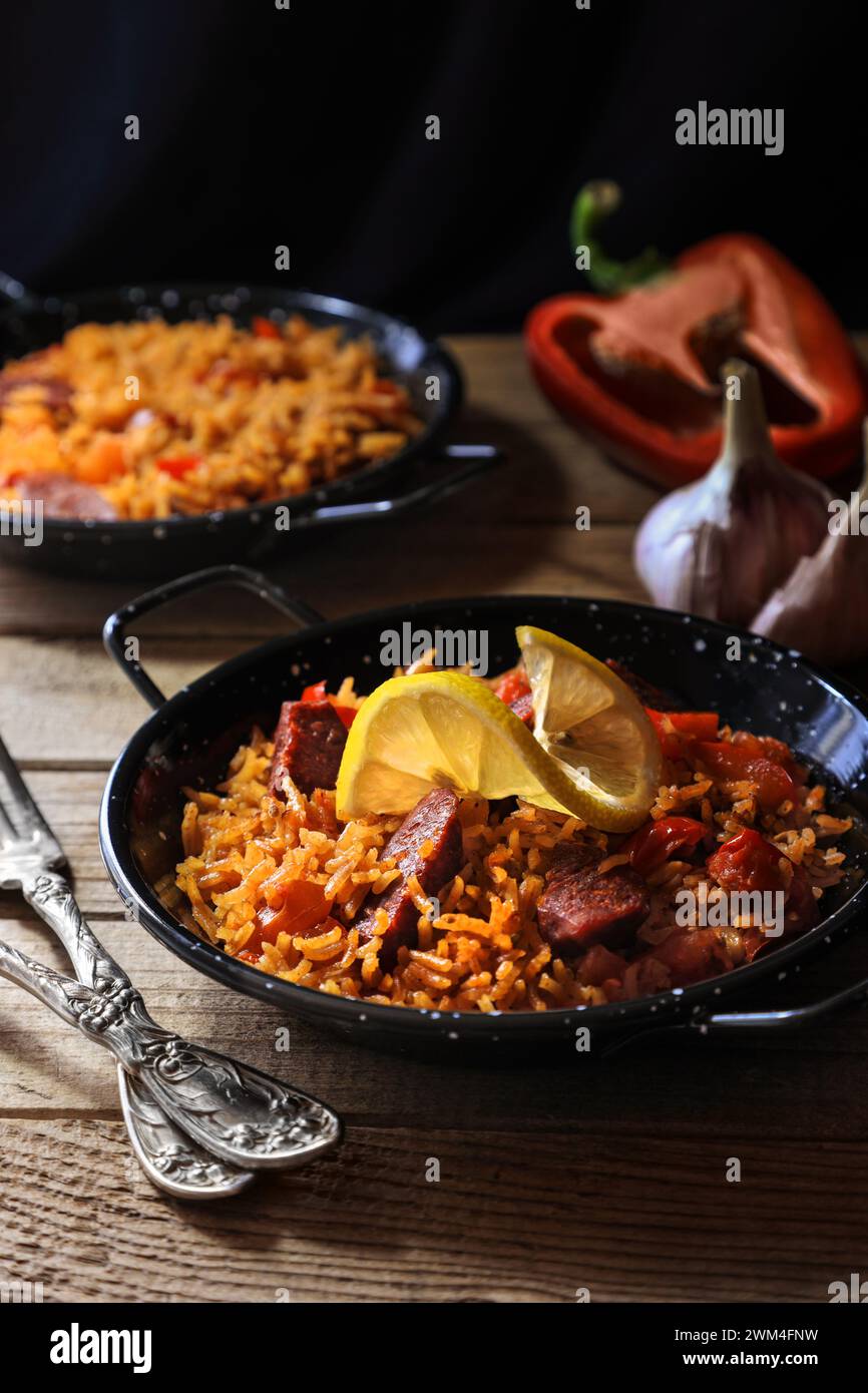 Spanish food specialty - chorizo sausage cooked with rice, tomatio ...