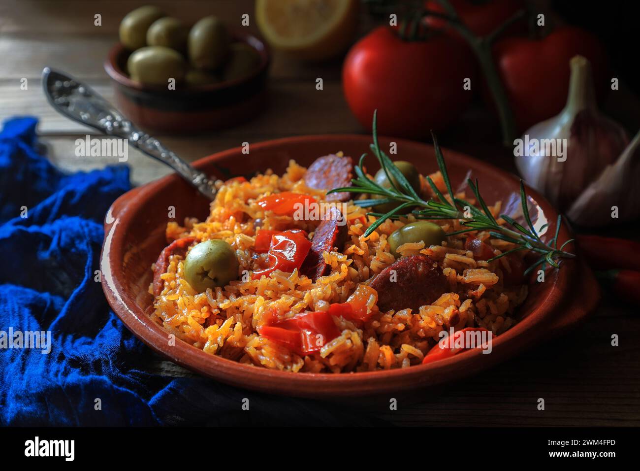 Spanish food specialty - chorizo sausage cooked with rice, tomatio ...