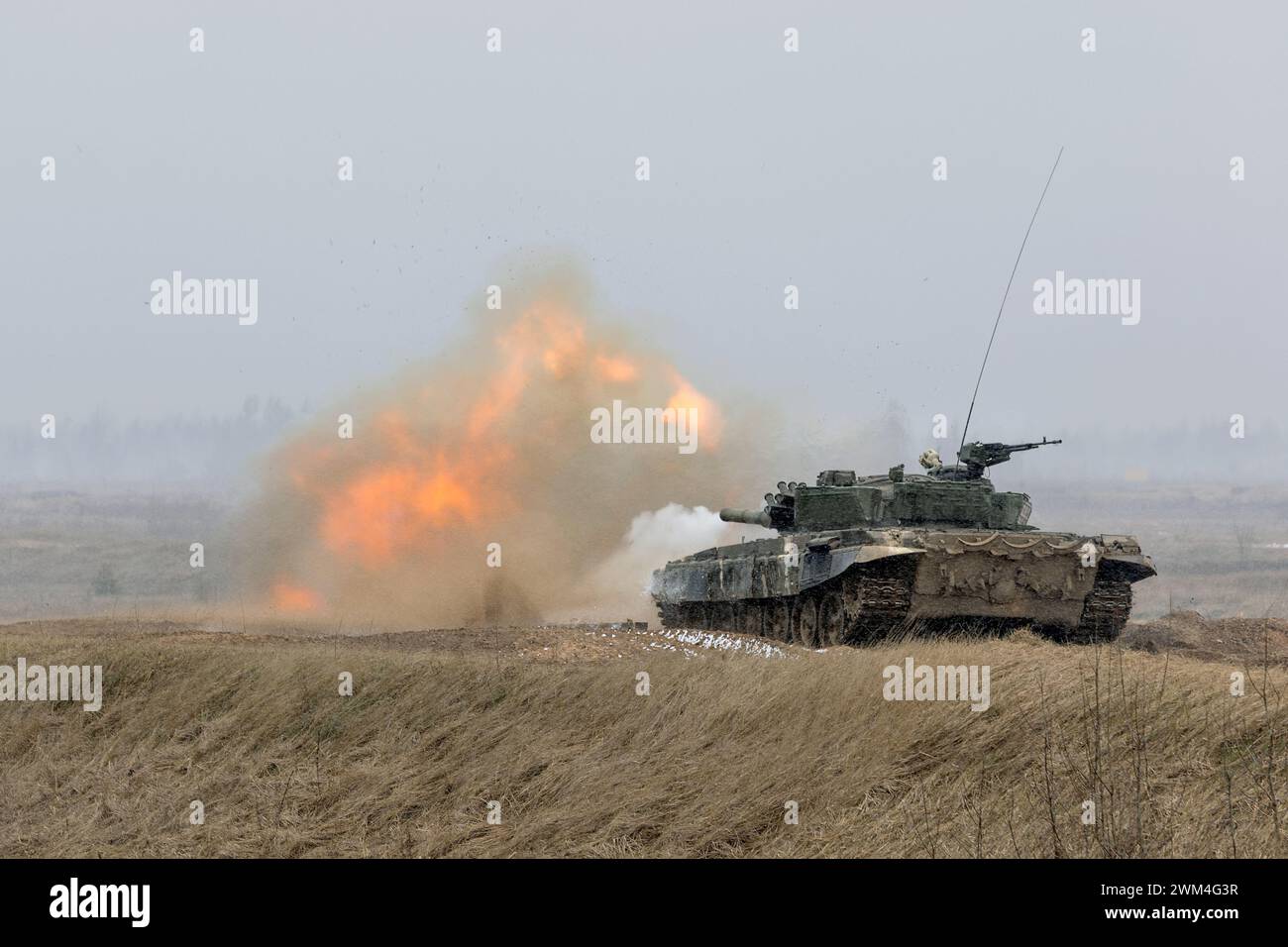 Fire and smoke from a tank shot during training at the training ground ...
