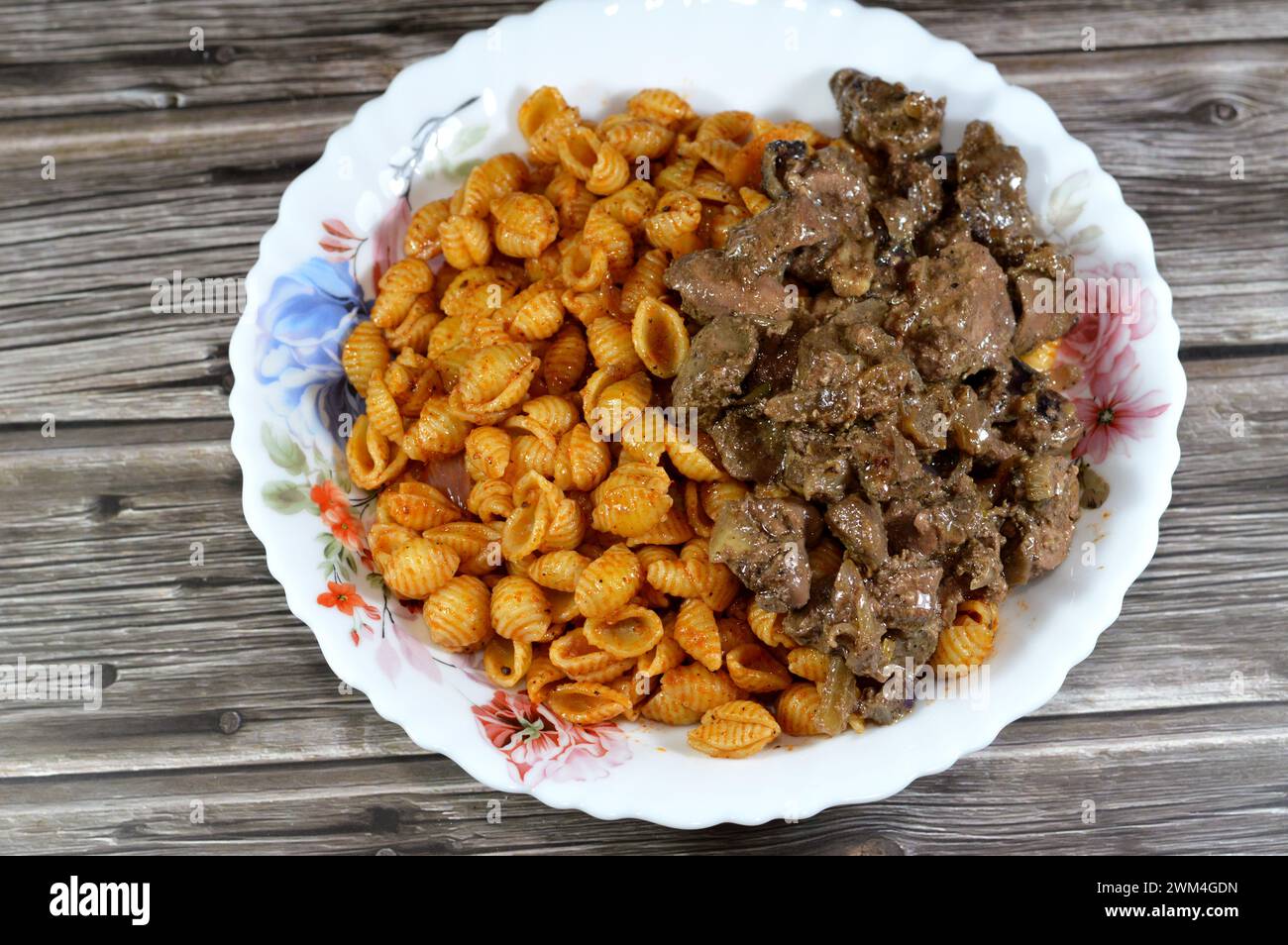 tasty appetizing classic pasta shell macaroni plate with tomato sauce ...