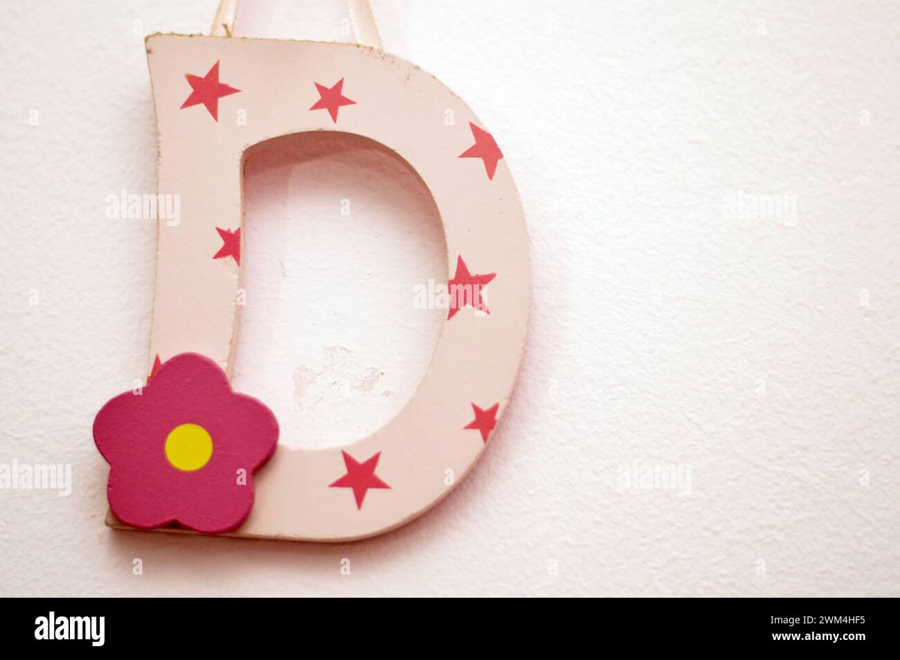 Letter D on the wall, the fourth letter in the Latin alphabet, used in ...