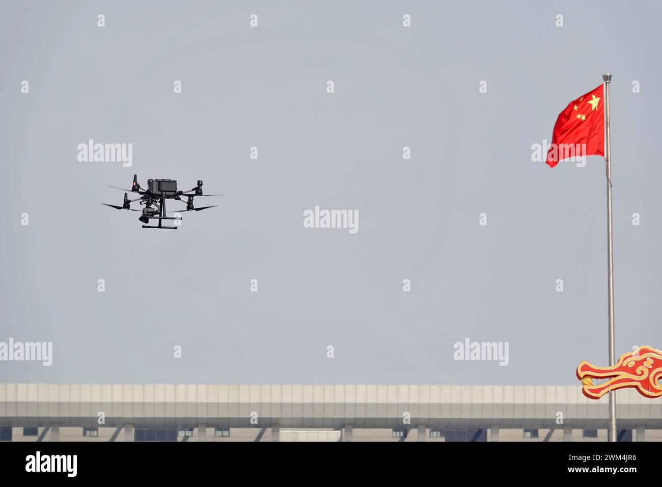 Yantai, China. 24th Feb, 2024. A DJI police drone is patrolling over ...