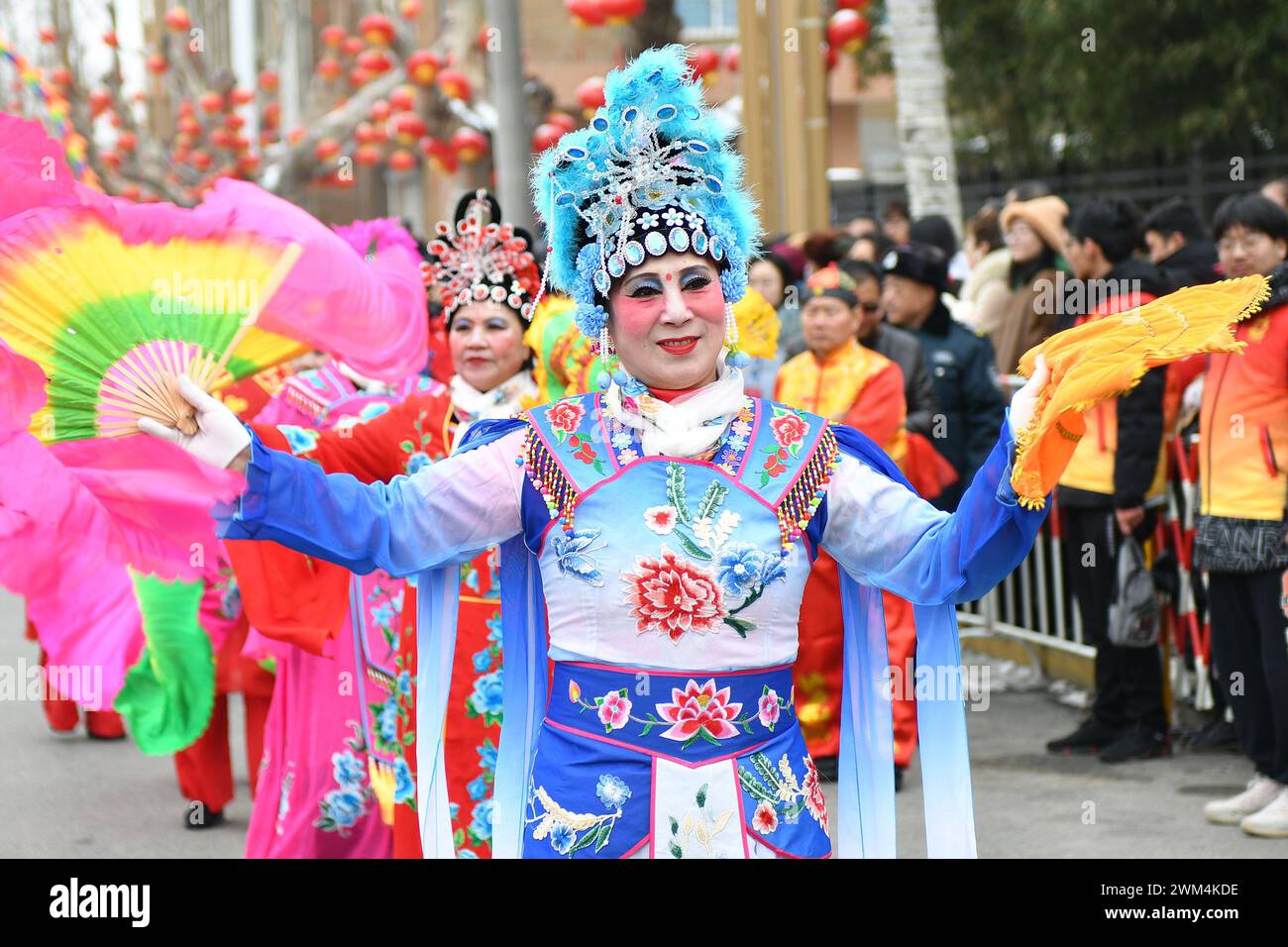 Yantai, China. 24th Feb, 2024. Folk artists are performing a folk show ...