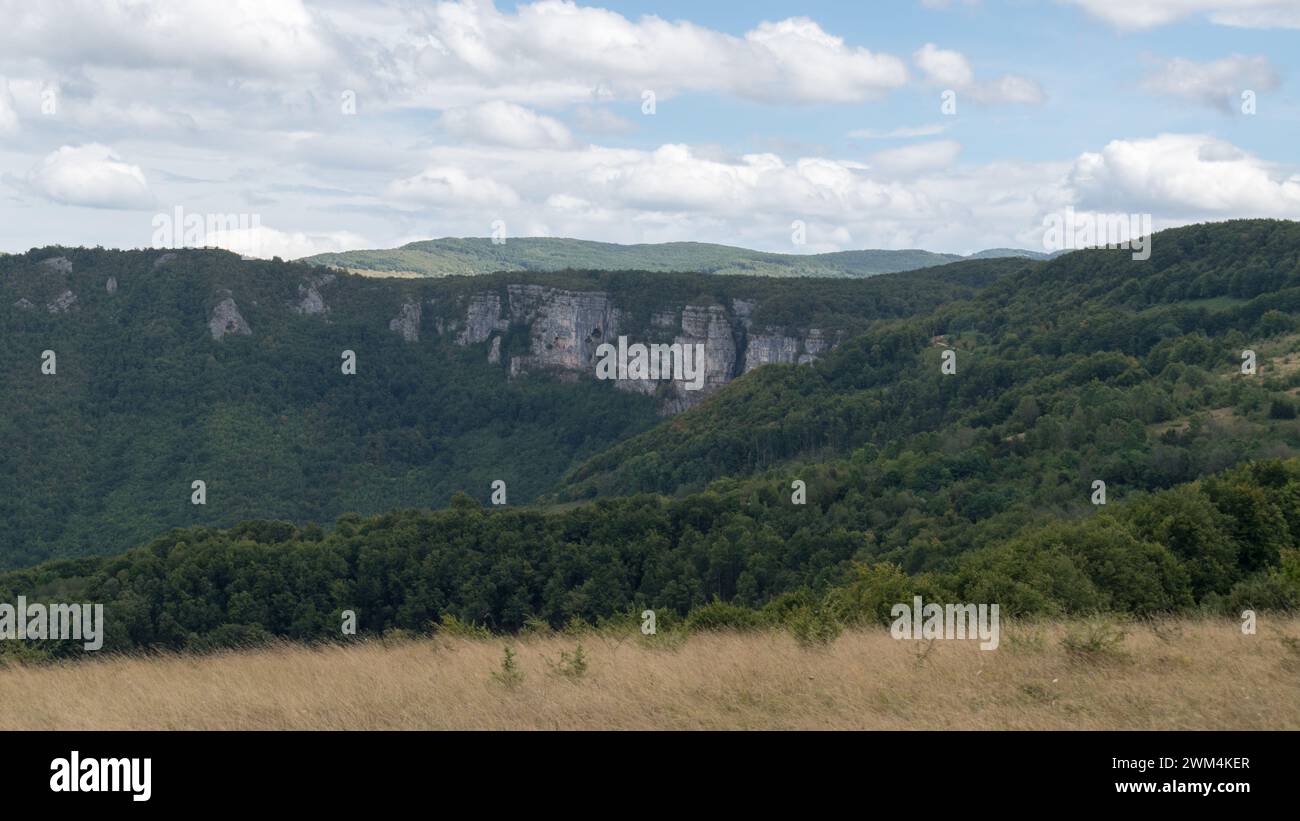 Mountain landscape with cliff during cloudy day Stock Photo - Alamy