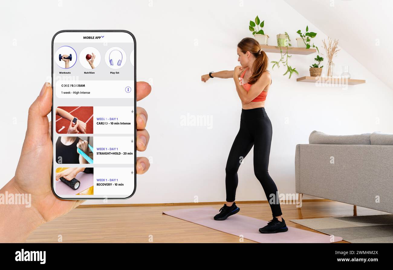 Sports mobile app. Woman doing workout at home using mobile phone ...