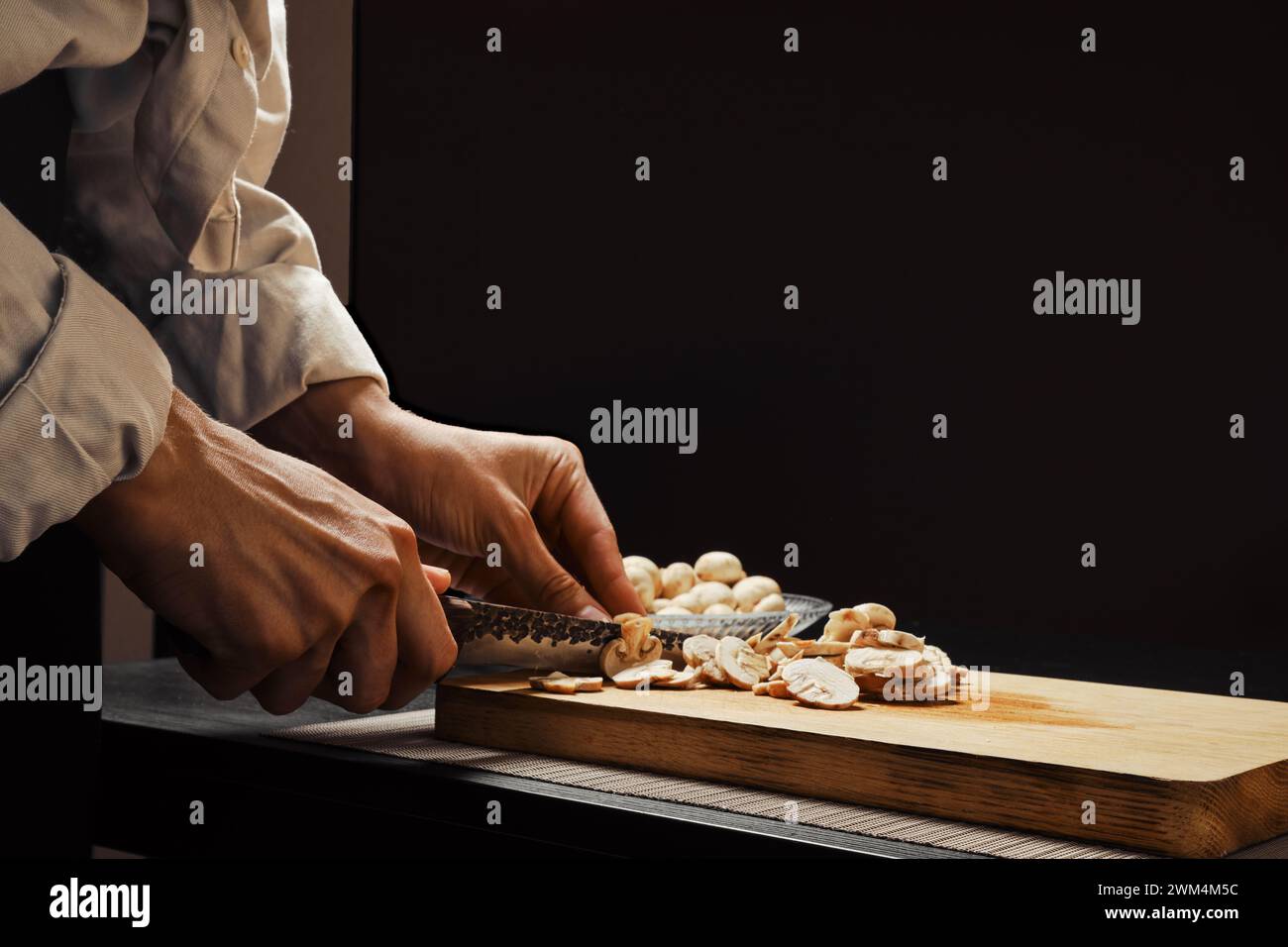 Human hands cut champignon mushrooms hi-res stock photography and ...