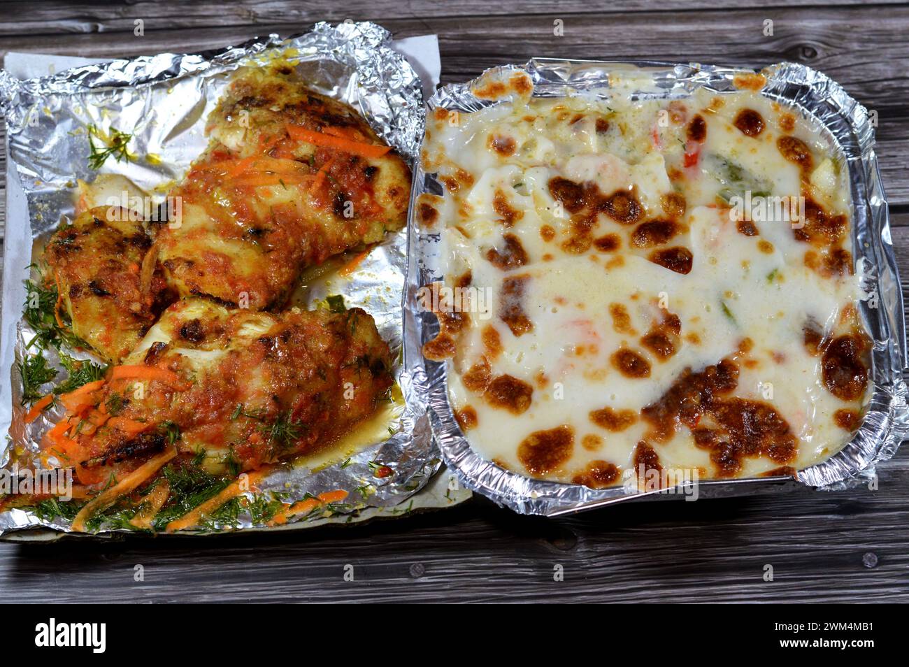 Baked creamy seafood baked mix of shrimps, squid calamari, fish fillet ...