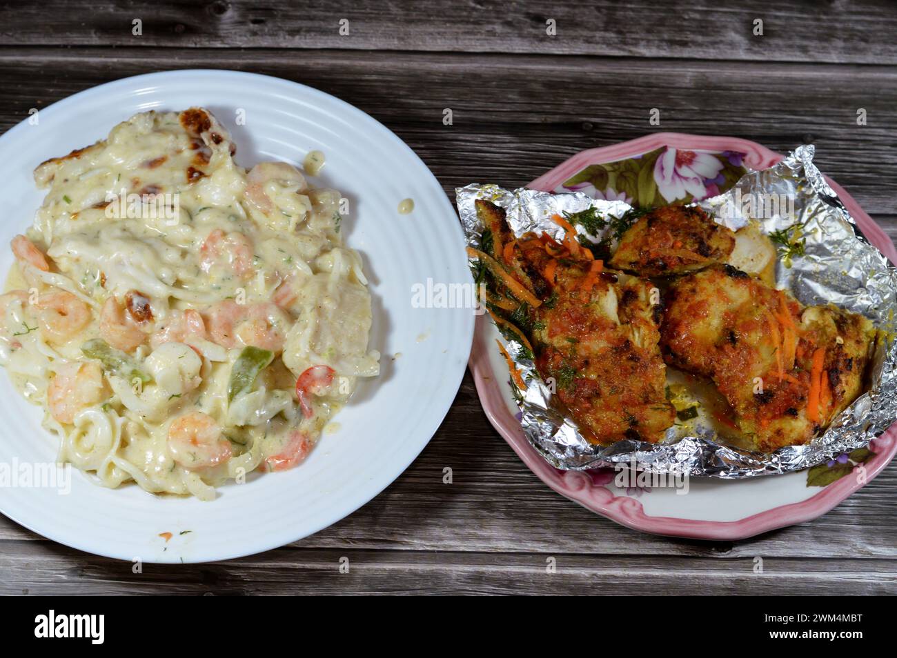 Baked creamy seafood baked mix of shrimps, squid calamari, fish fillet ...