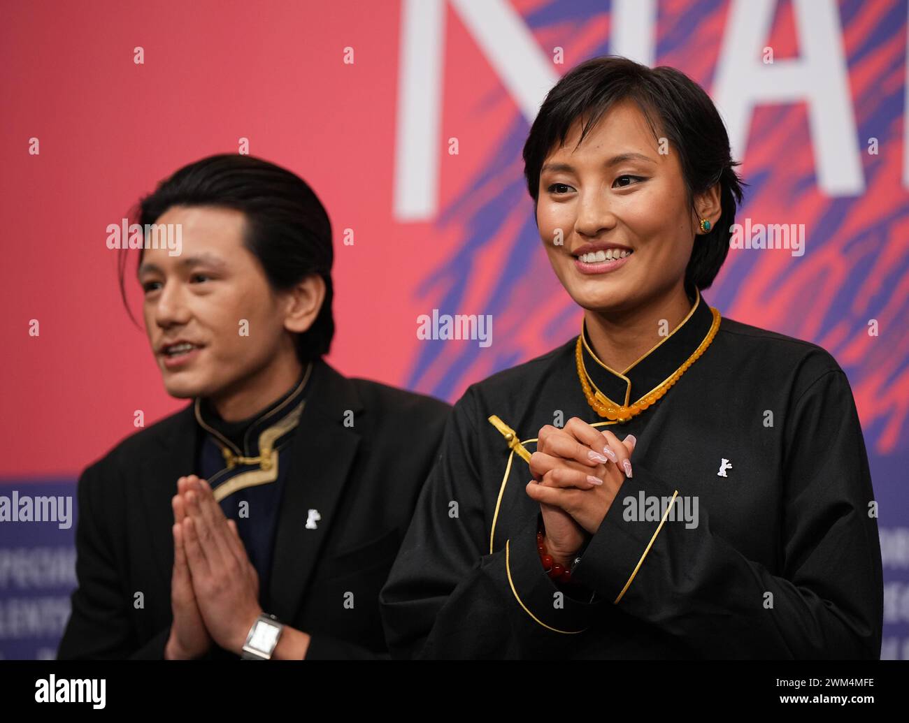 Berlin, Germany. 23rd Feb, 2024. Actress Thinley Lhamo (r) and Tenzin Dalha (l) thank for the ...