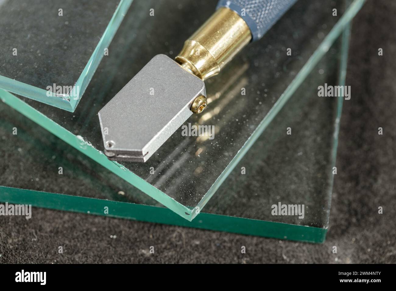 Glass cutting tool lying on the glass, Work and tools of a glazier ...