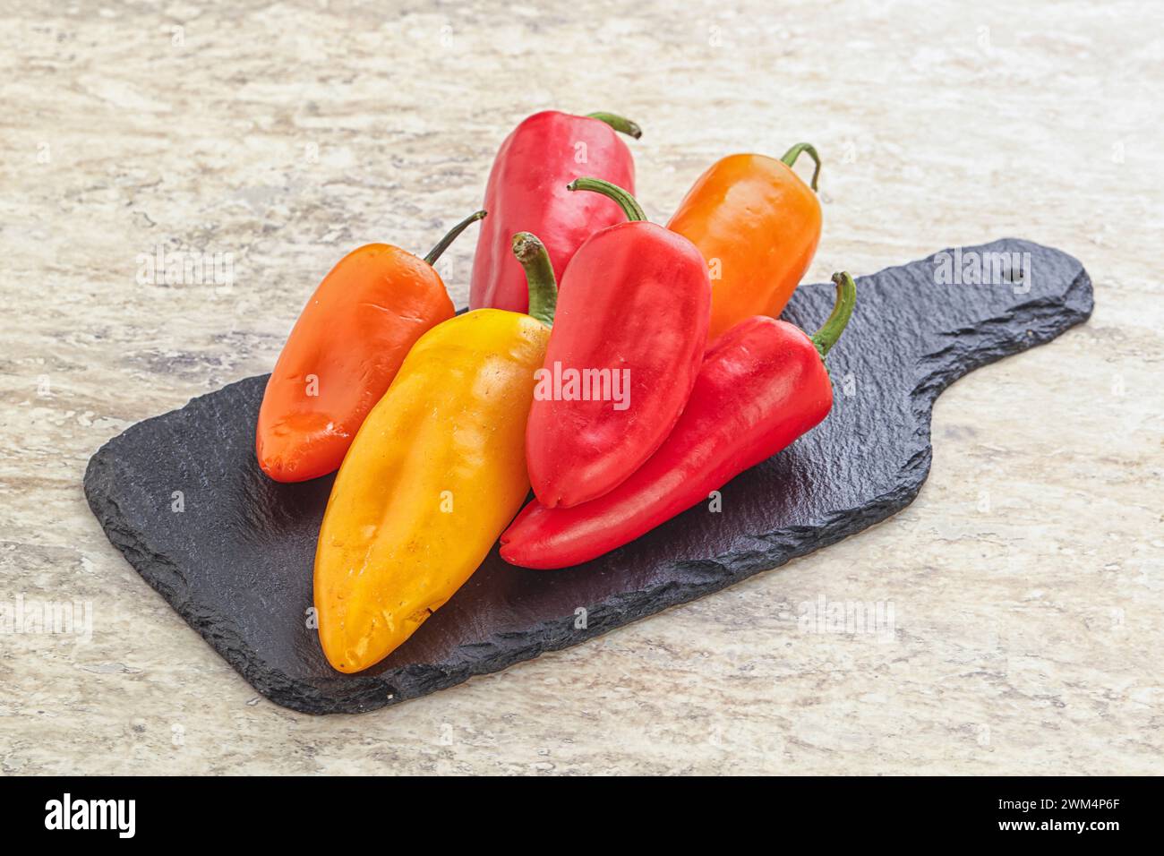 Ripe juicy baby various color bell peppers heap Stock Photo - Alamy