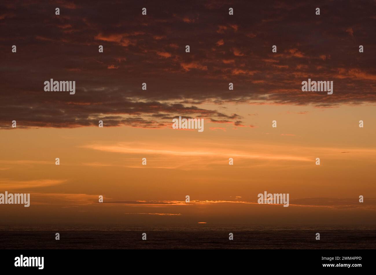 Sunsetting with clouds from the eastern horizon as seen from Barter Island 1002 coastal plain ...