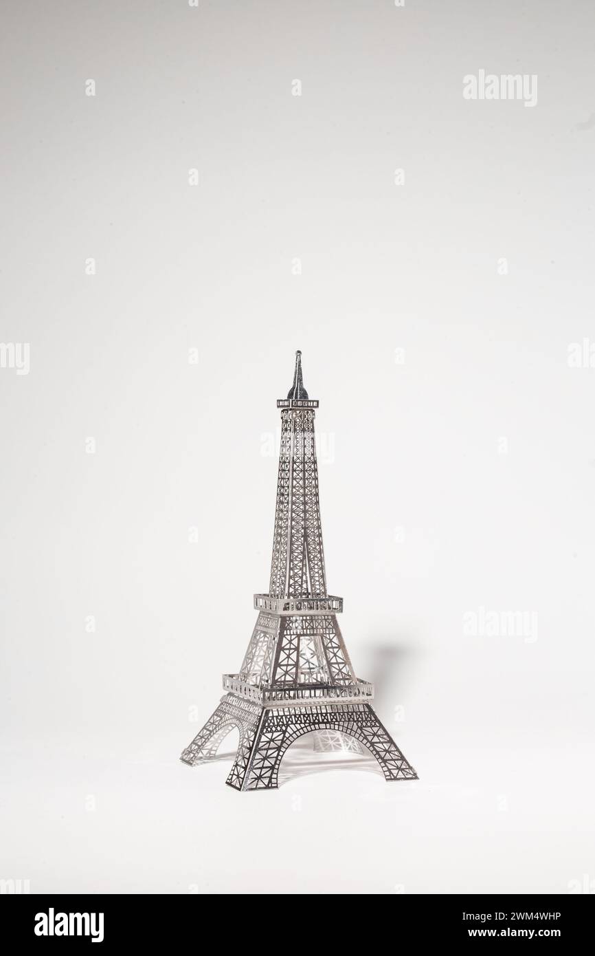 Metal Eiffel Tower Cutout On White Background Lattice Design Highlights Skill And Precision