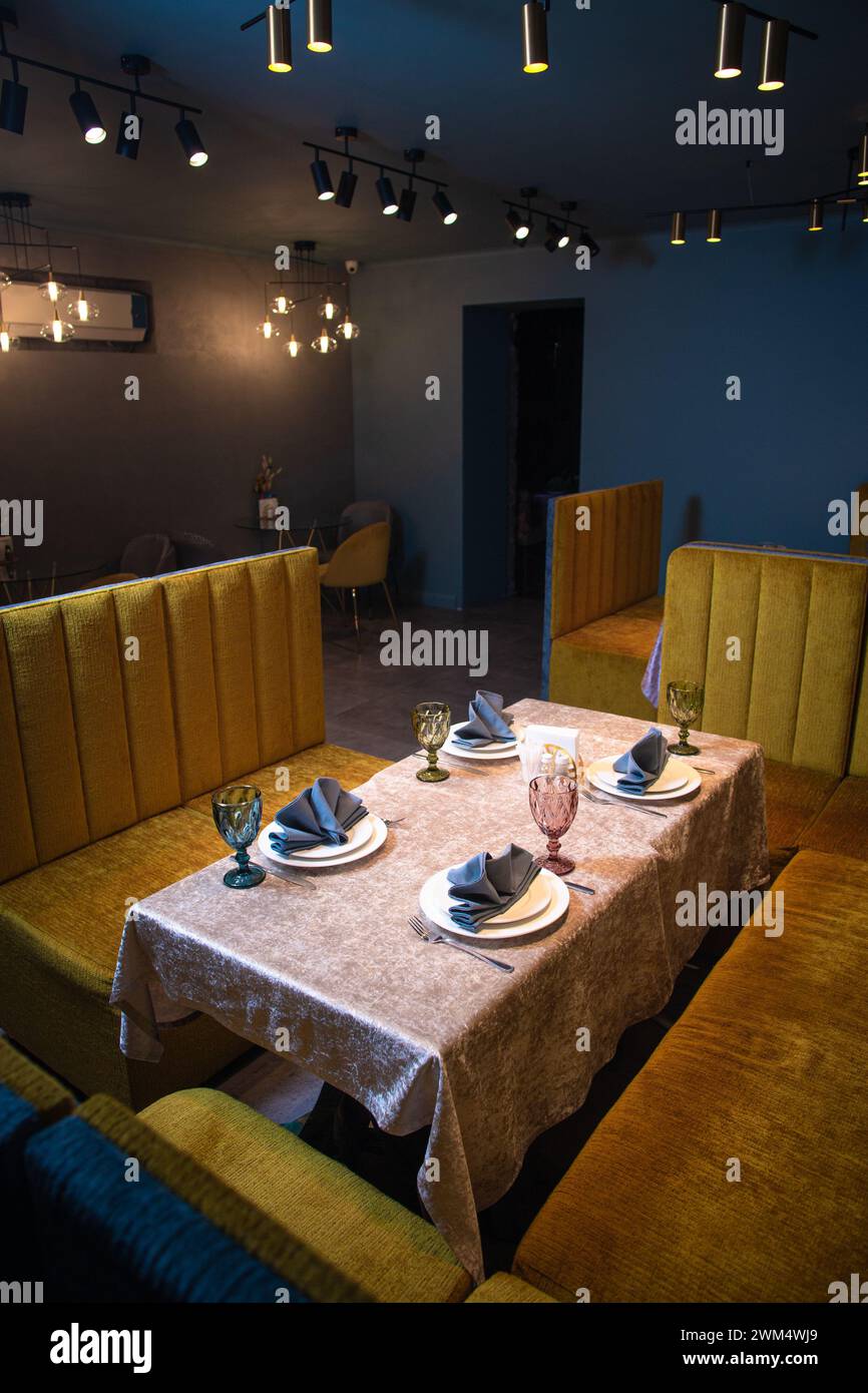 This image showcases an elegant restaurant interior with a table set ...