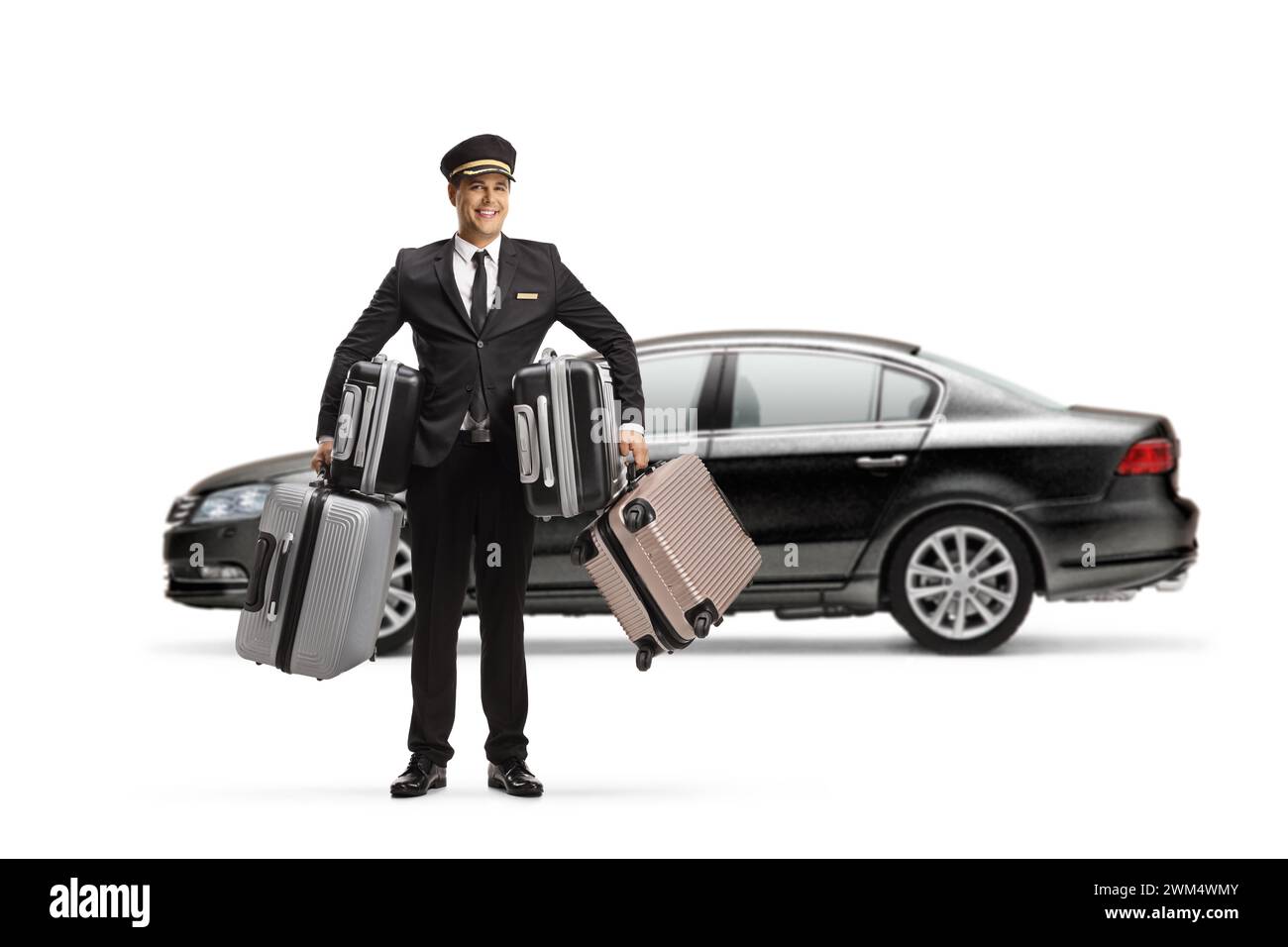 Full length portrait of a chauffeur holding suitcases in front of a ...