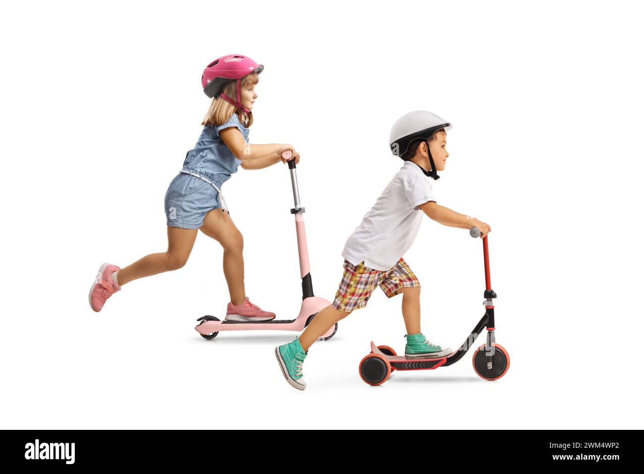 Boy and girl riding push scooters isolated on a white background Stock ...