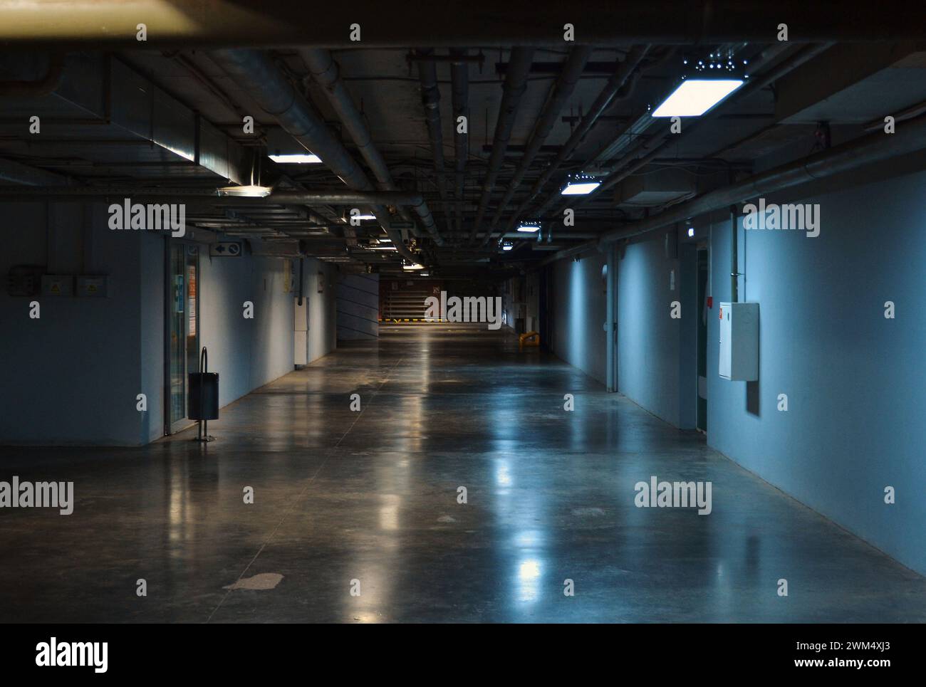 The technical room on the underground floor is illuminated by yellow ...