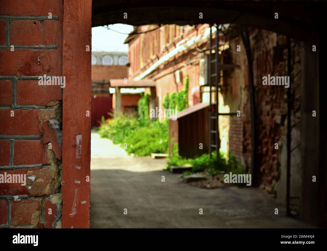 The texture of an old brick wall against the background of the arched ...