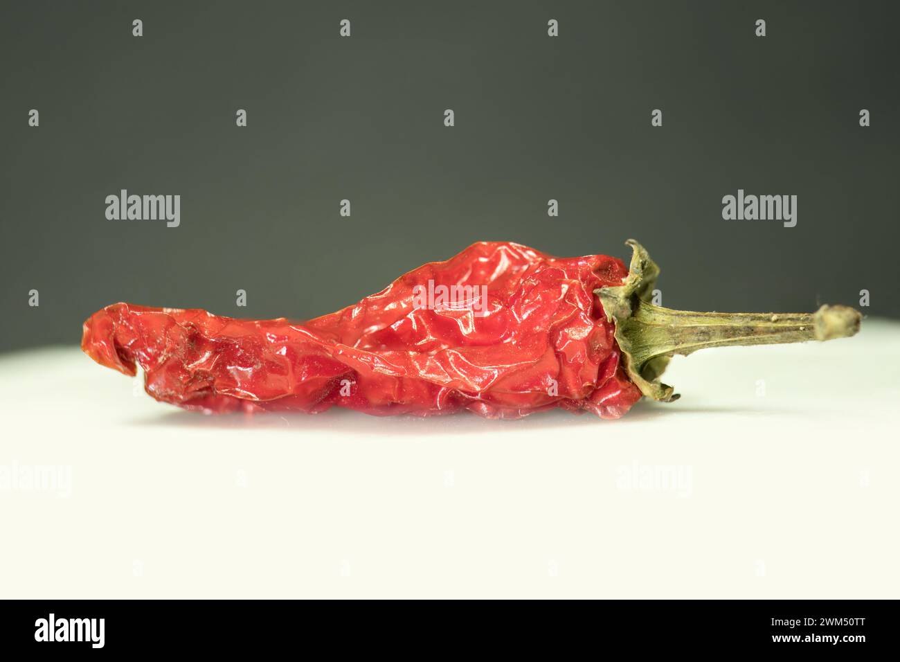 Aged Elegance: The Vivid Texture of a Wrinkled Red Chili Pepper, This ...