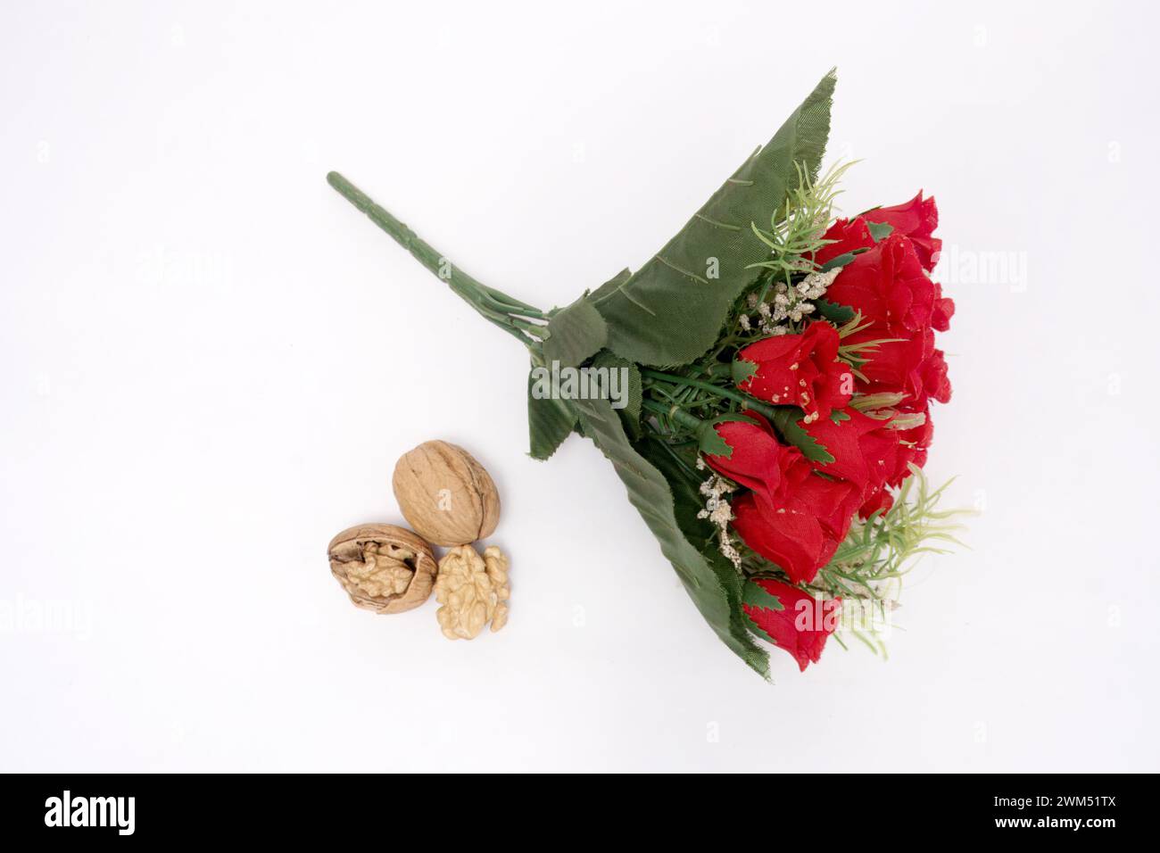 Elegant Red Roses And Fresh Walnuts: A Blend of Natural Beauty and Nutrition, A vibrant bouquet ...