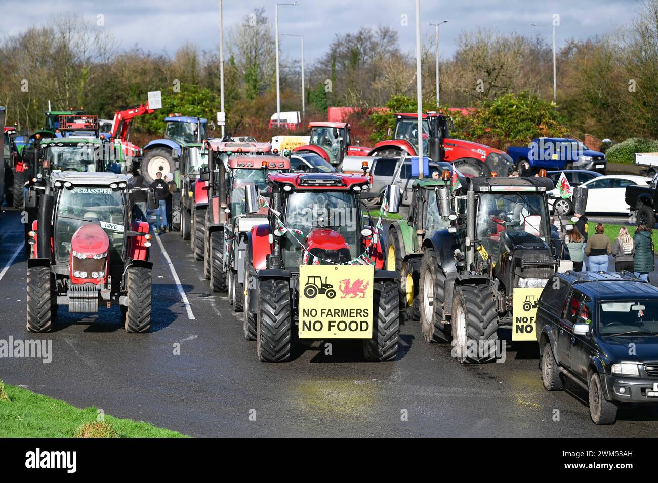 Farmers take part in a drive-slow protest in their tractors and farm ...