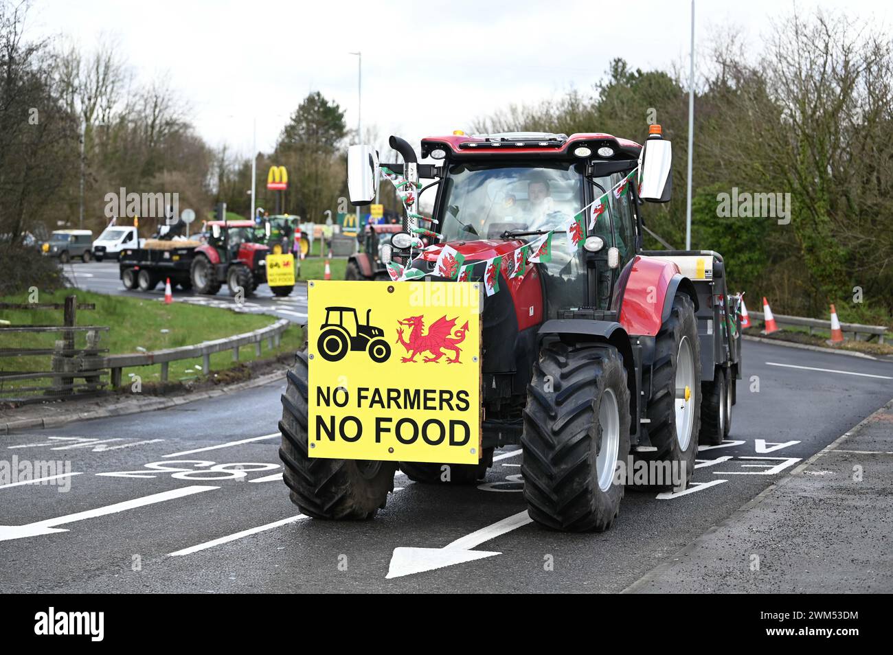 Farmers take part in a drive-slow protest in their tractors and farm ...
