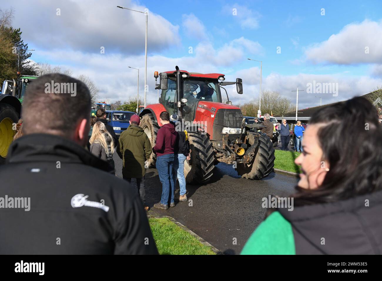Farmers take part in a drive-slow protest in their tractors and farm ...
