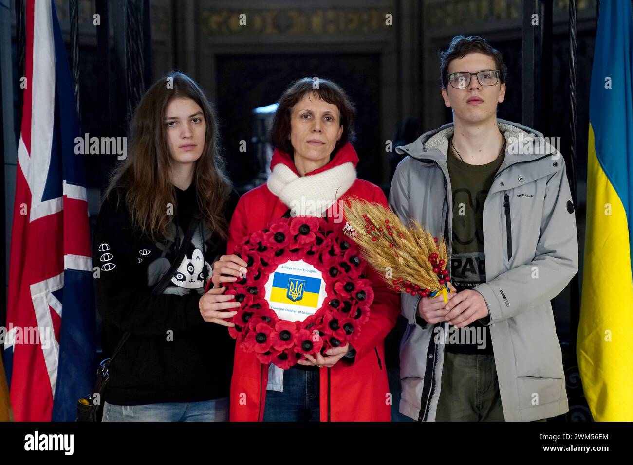 Oksana Rybalchenko with her daughter Kateryna (left) and son Denys (right) before a service to ...