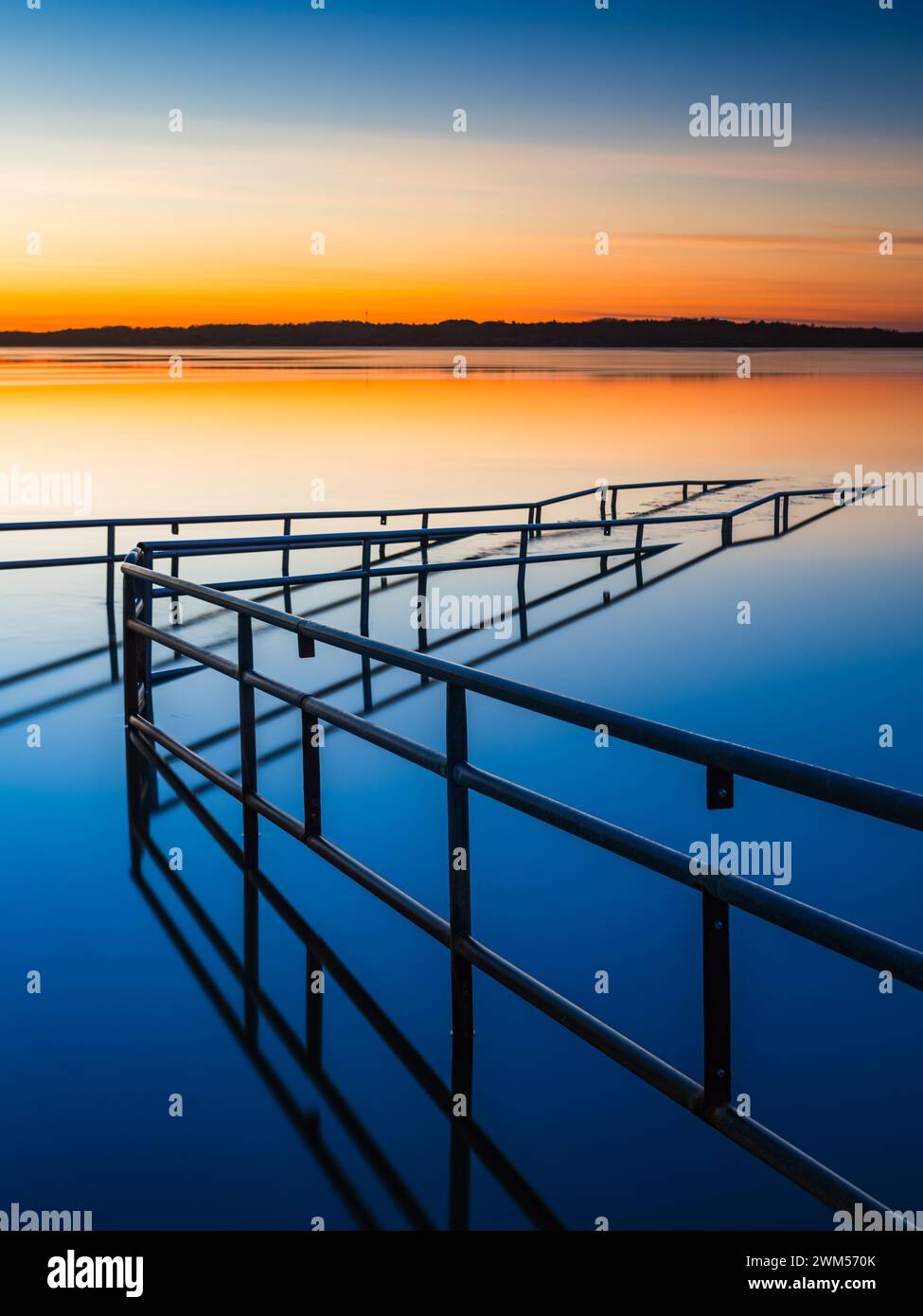 Tranquil sunset unfolds over still hi-res stock photography and images ...