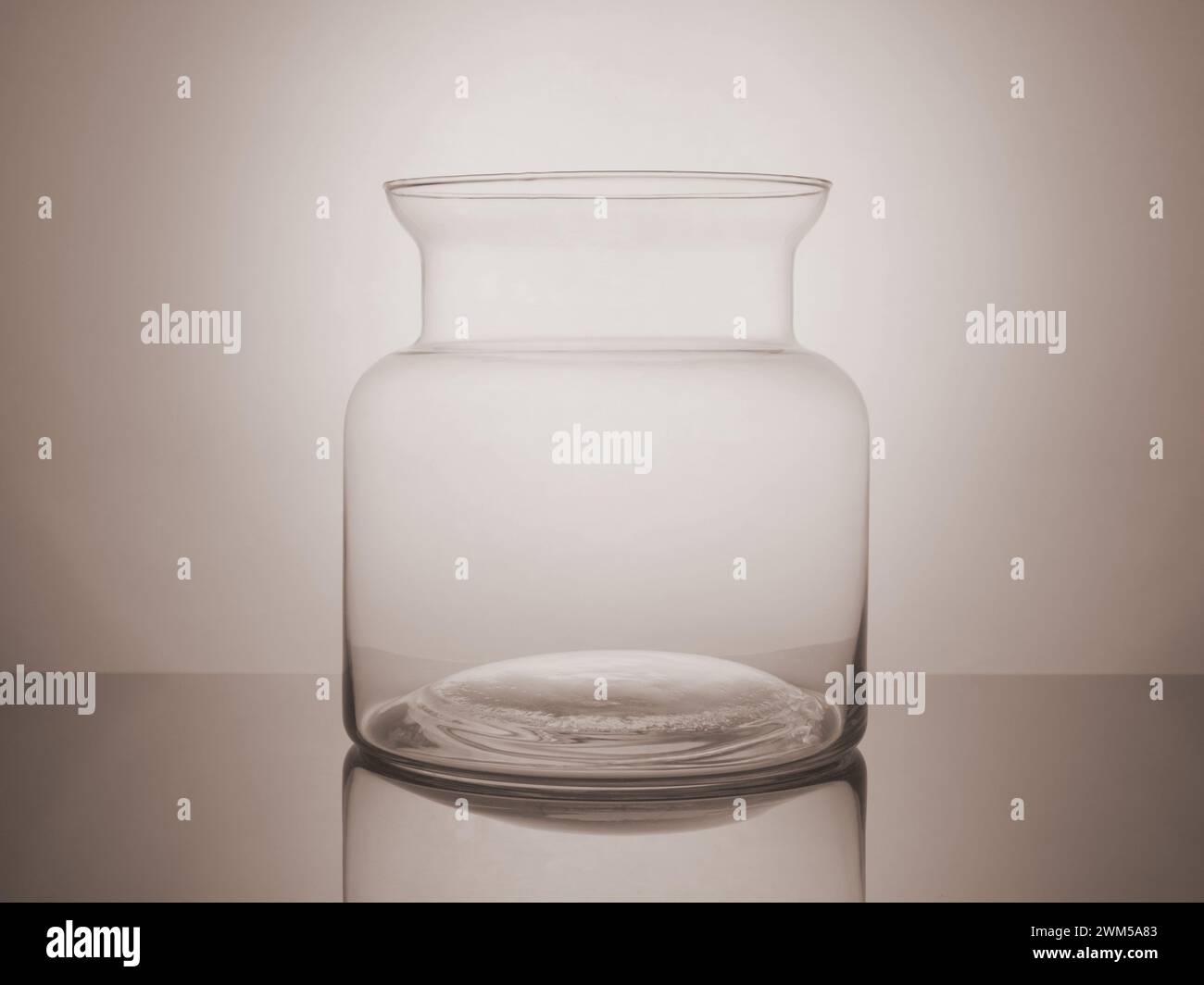 An elegant set of glassware bathed in a soft, glowing backlight ...