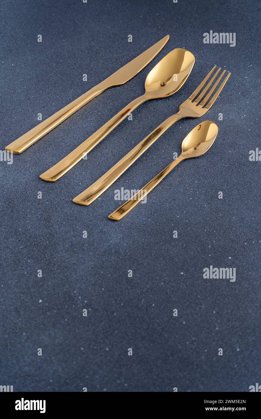 Set of cutlery made of gold metal. Fork, spoon, knife, teaspoon Stock ...