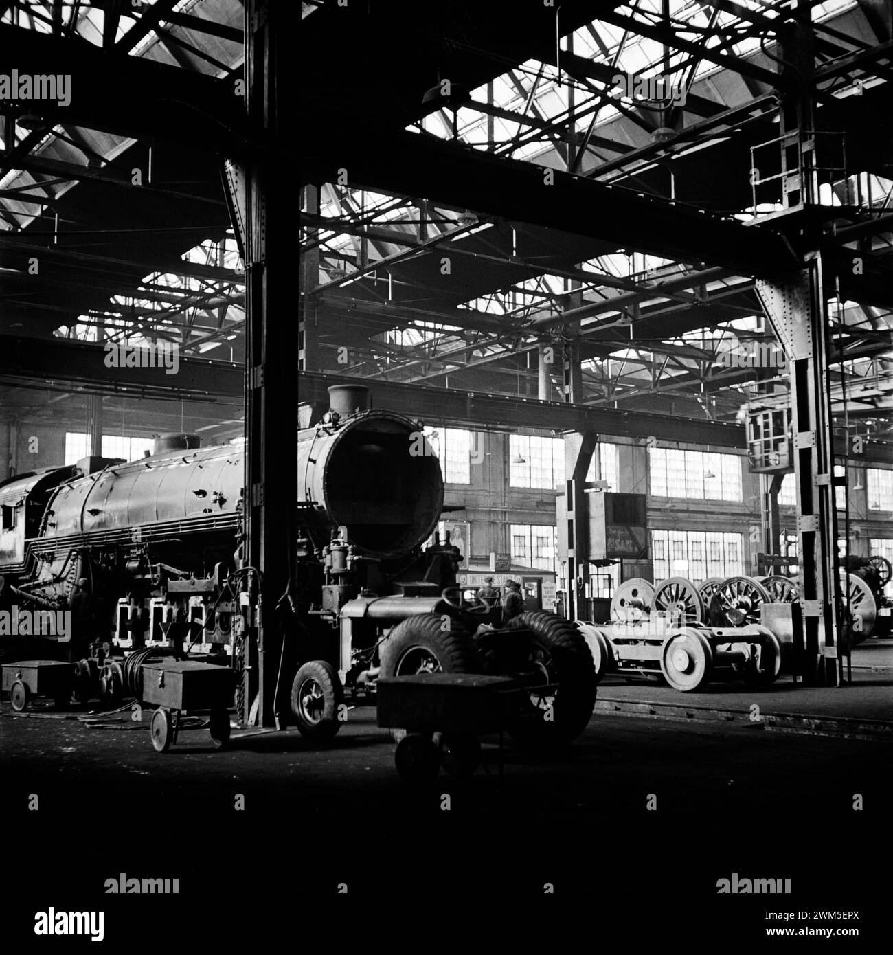 Chicago, Illinois. Locomotives in for repair at the roundhouse at an ...