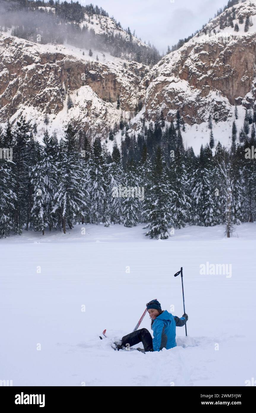 Native indian women cross-country skier takes a fall in Mazama, Methow ...
