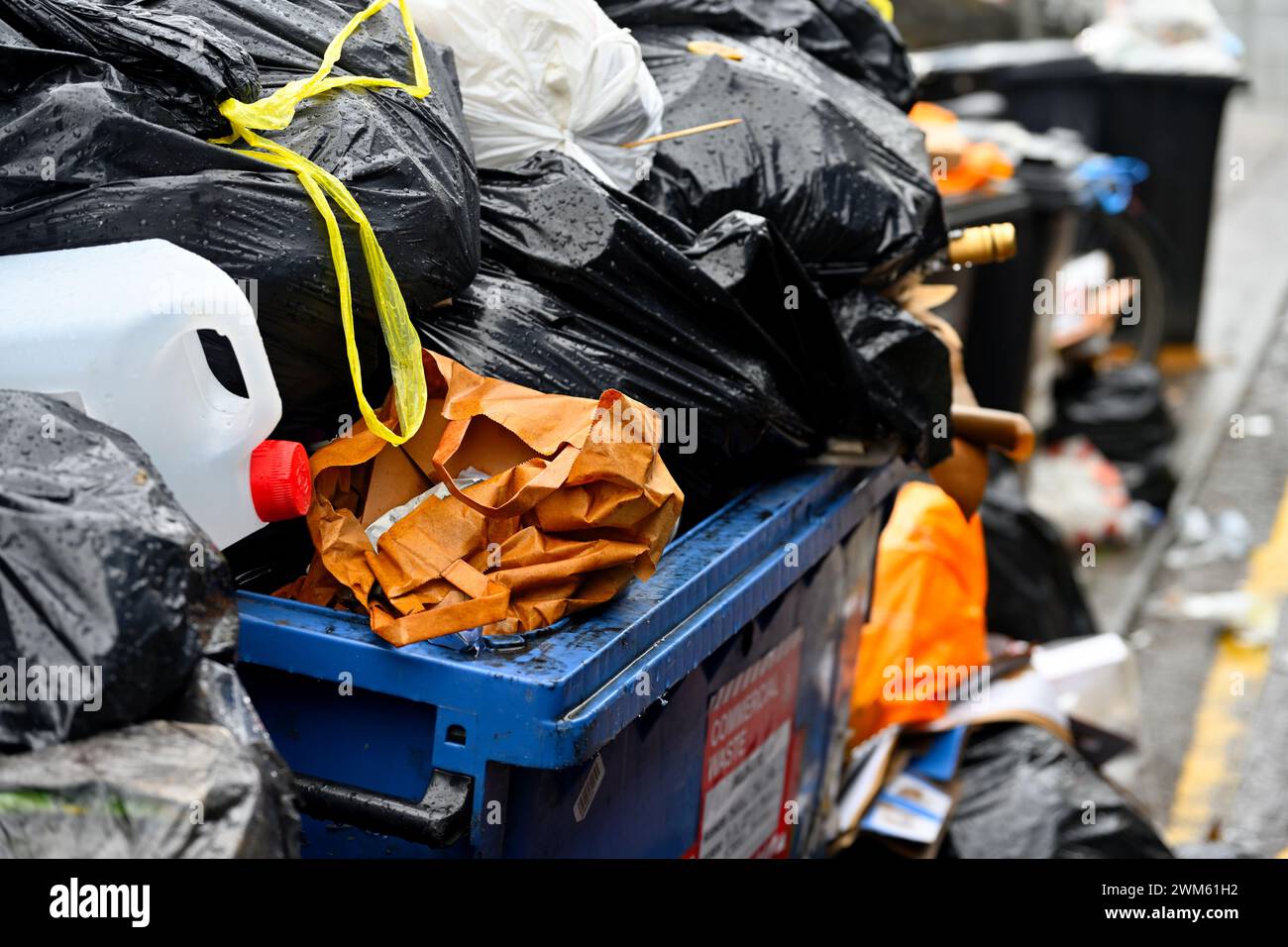 Overflowing recycling waste bins hi-res stock photography and images ...