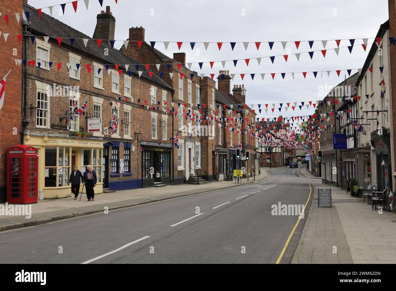 Flags along the Main Street of Ashbourne town; Peak District National ...