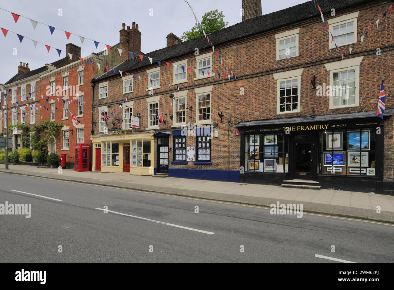 Flags along the Main Street of Ashbourne town; Peak District National ...