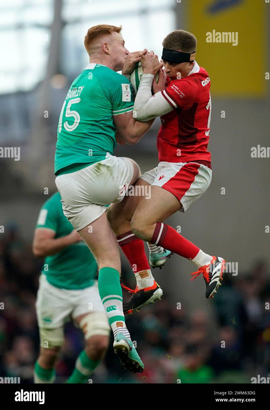 Ireland's Ciaran Frawley (left) and Wales' Cameron Winnett battle for ...